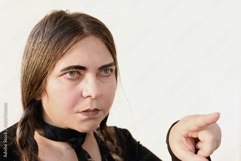 portrait of mature freak woman heavily rudely made up in gothic style ...