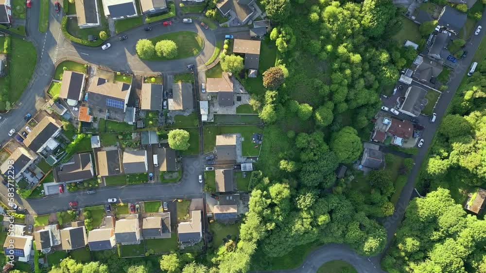 Top down aerial view of residential streets and roads in a small town ...