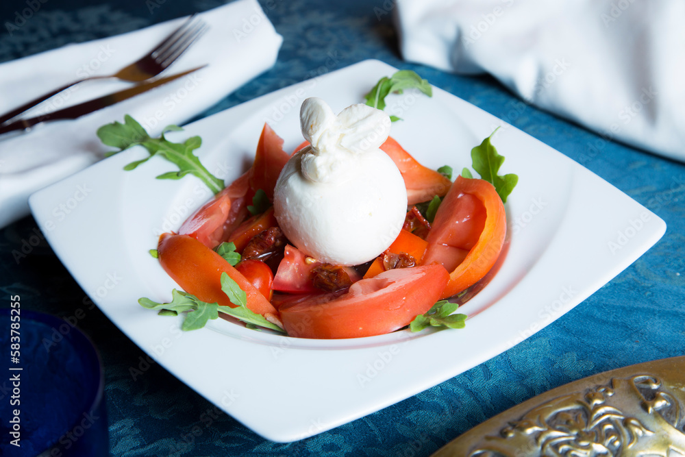 Burrata salad. The burrata is a fresh cow's milk cheese, with spun ...