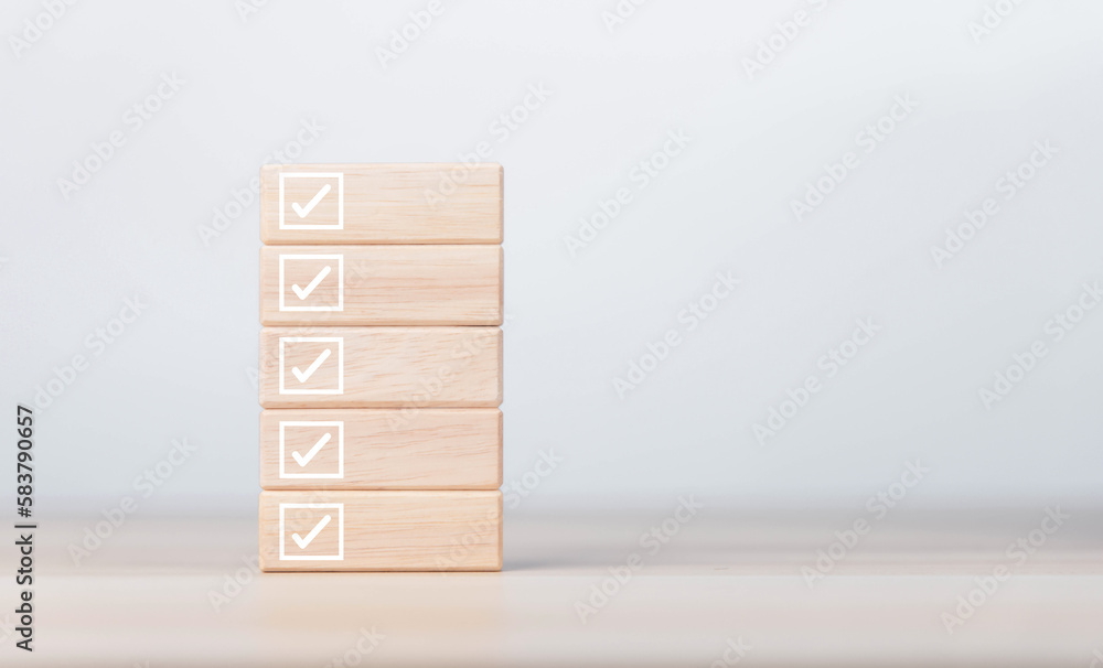 wooden block showing check mark Checklist ideas in business surveys and ...
