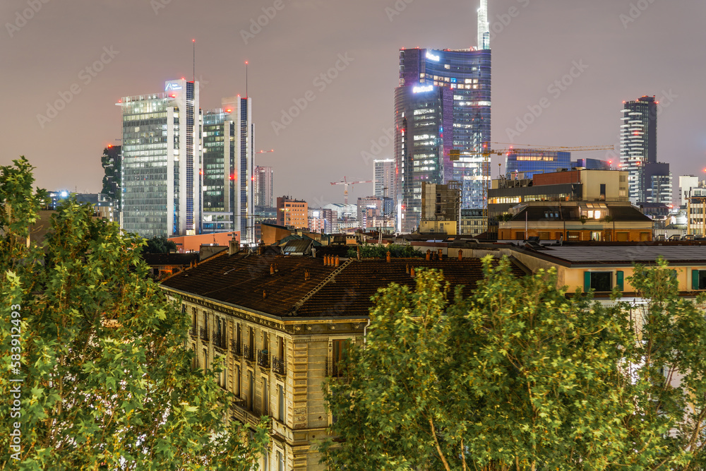 Milan, Italy skyline night view of illuminated skyscrapers at Gae ...