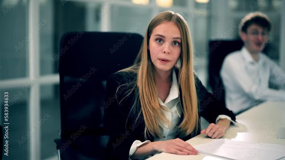 A young, angry woman is unable to contain her anger in the office ...