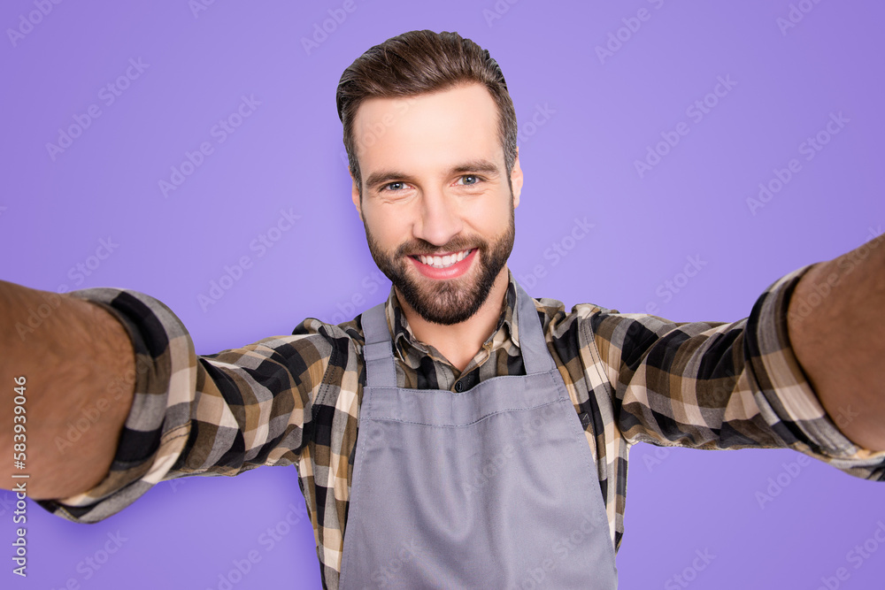 Self portrait of trendy stylish baker with hairstyle shooting selfie on ...