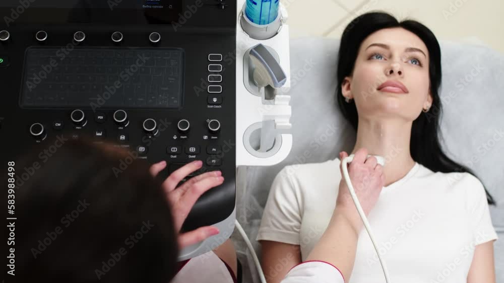 The doctor's hand conducts a medical examination of the patient using ...