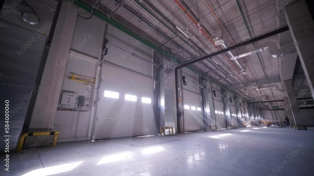 Construction process of a big, modern warehouse with multiple garage ...