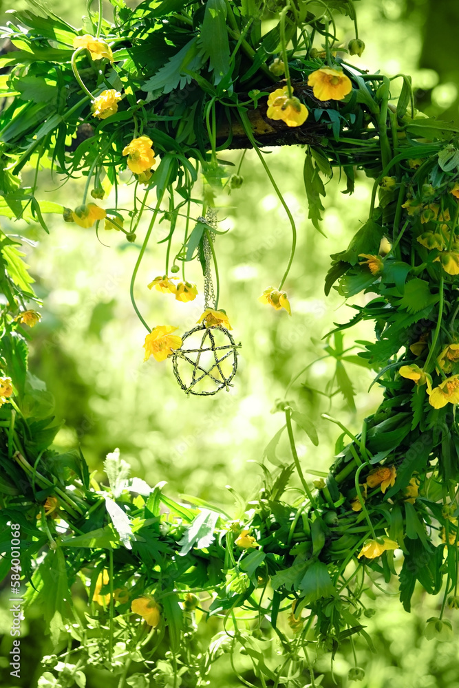 floral wreath with pentagram amulet in forest, green natural abstract ...