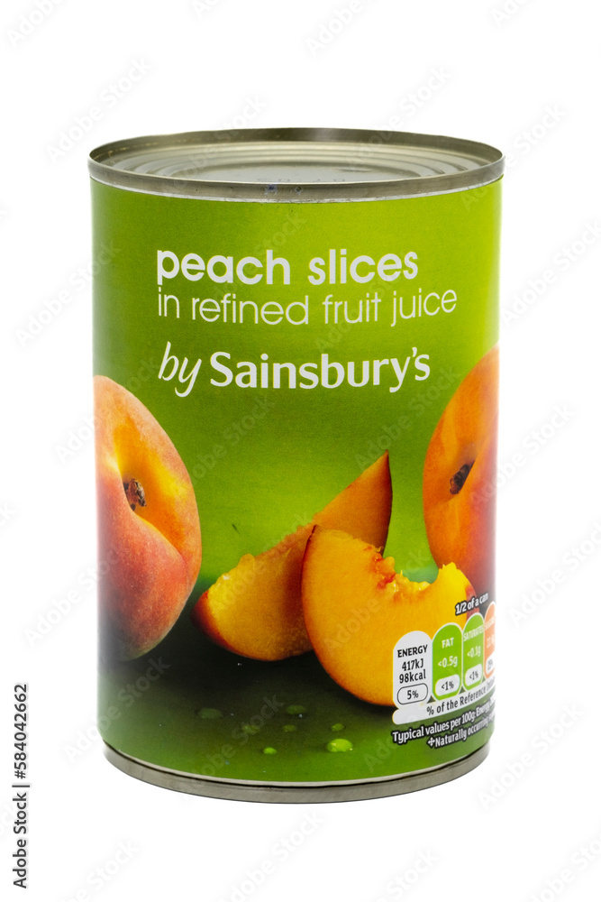 Sainsbury’s branded peach slices in fruit juice in a tin can with label ...