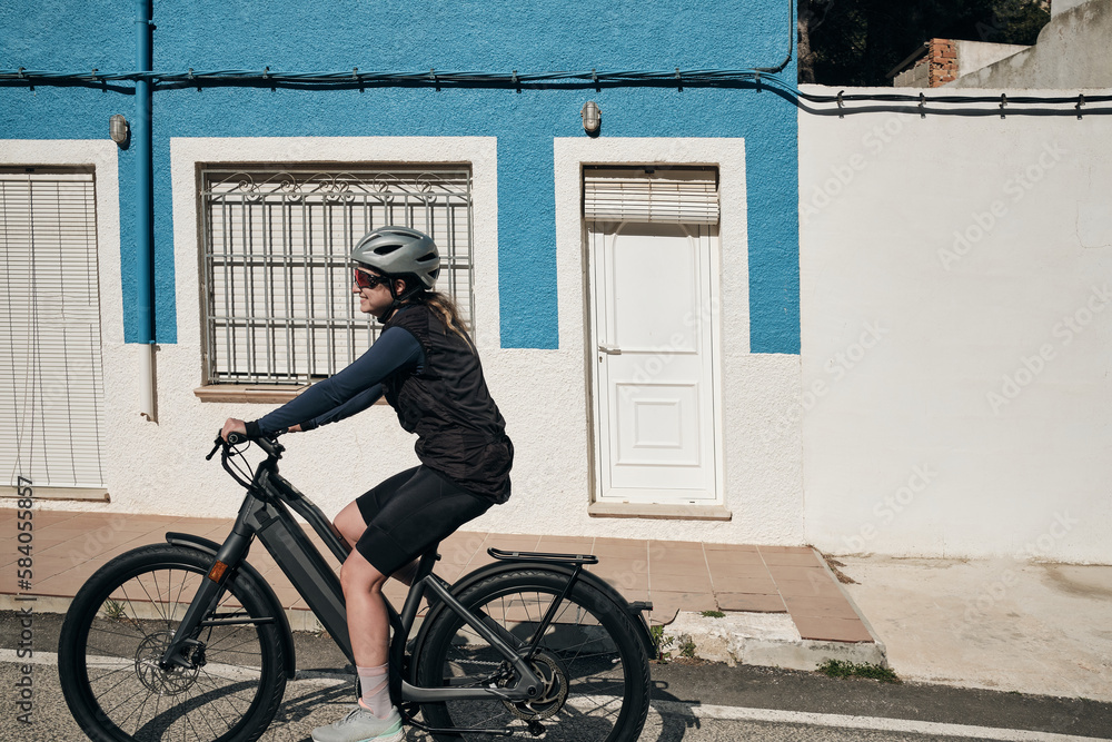 Electric bike adventure.A woman cyclist's journey on an E-Bike.Cyclist ...