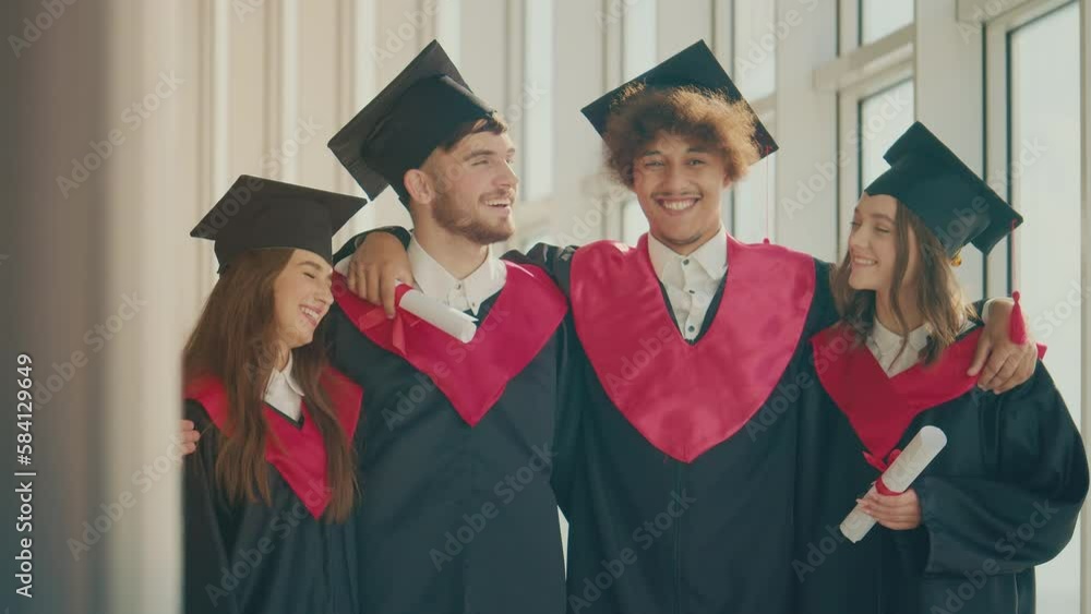 Video Stock Portrait of Positive Group of four Graduates With Diplomas ...
