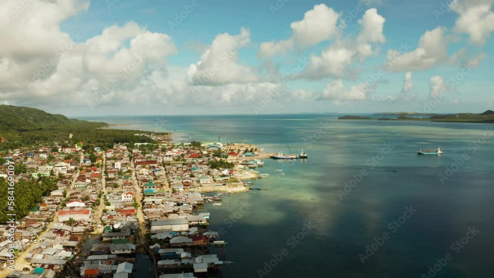Freight ships and ferries in the bay, top view. Dapa Ferry Terminal ...