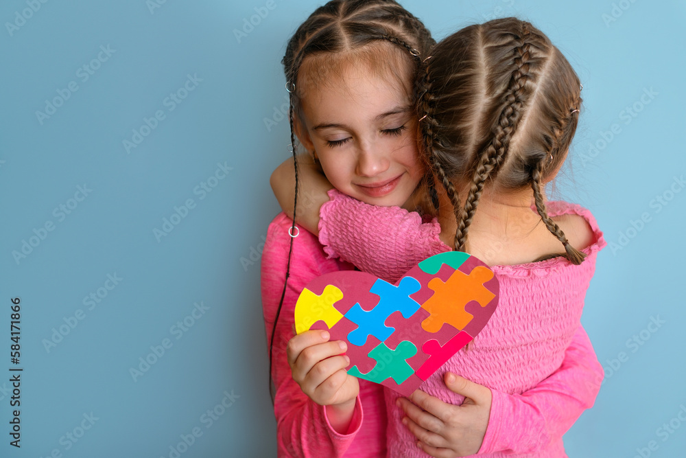 Girl hugs autistic sister tightly as sign of support and comforts ...