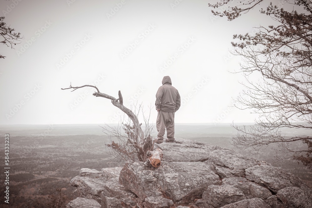 man standing on cliff edge after hiking up Cheaha State Park Mountain ...