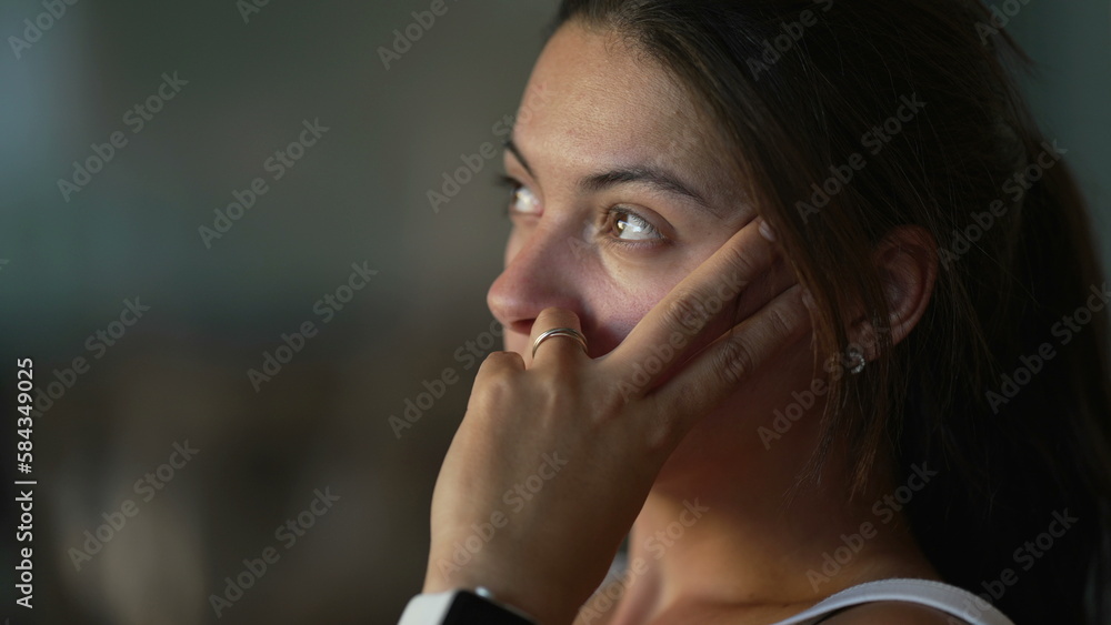 Contemplative woman thinking deeply at apartment balcony. Pensive ...