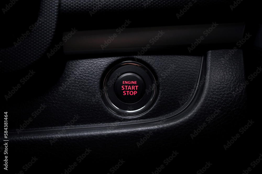 The dashboard shows details of the start button in the car. red engine ...