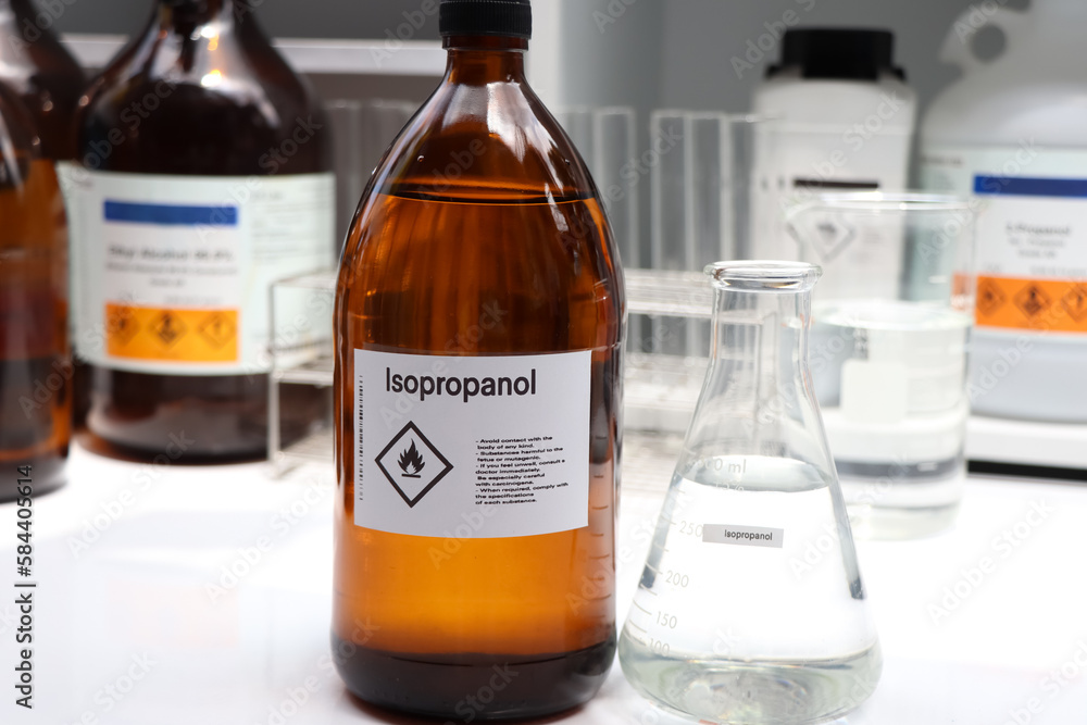 Foto de Isopropanol in glass, Hazardous chemicals and symbols on containers in industry do Stock ...