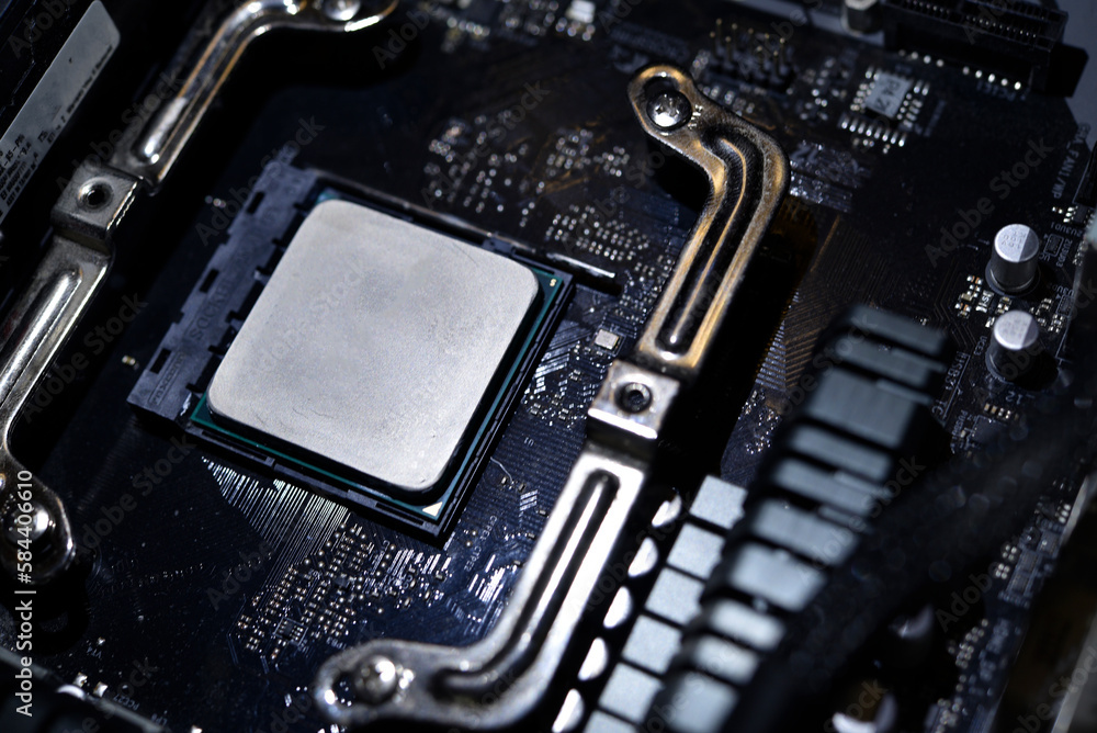 Applying thermal paste to the surface of the computer processor ...