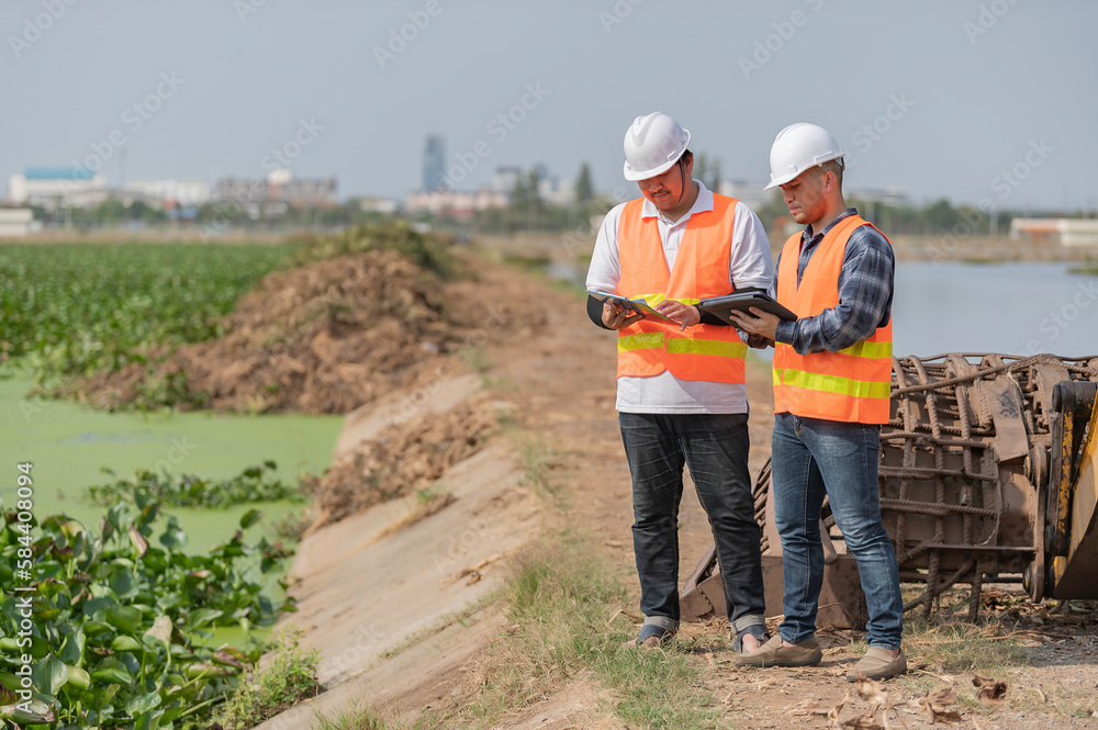 Environmental engineers inspect water quality,Bring water to the lab ...