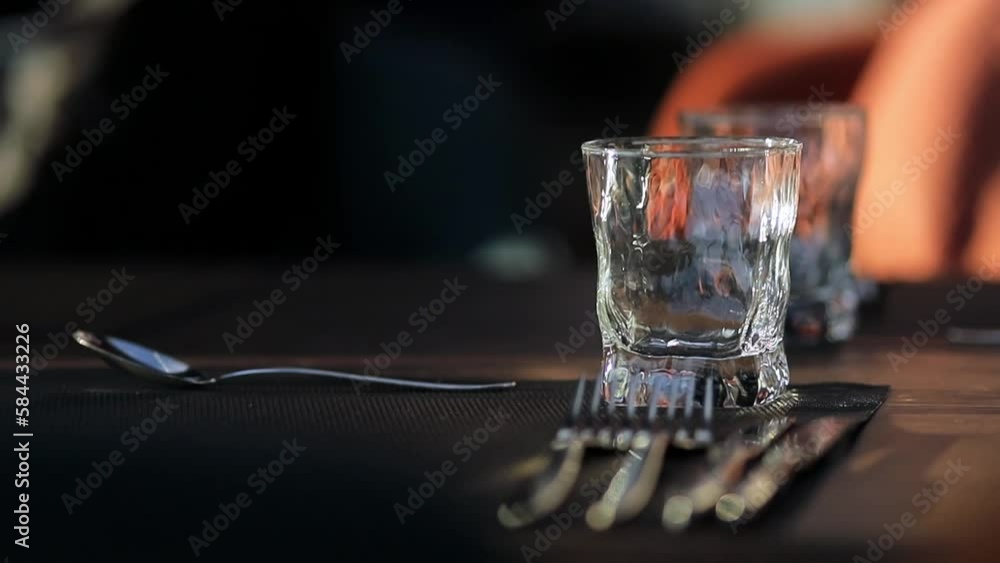 an empty glass for alcohol on a table in a restaurant. Empty crystal ...