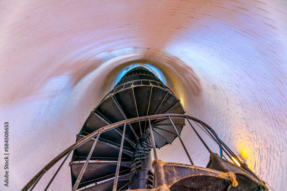 MIAMI, FLORIDA - CIRCA JULY, 2022: Low angle view of spiral stairs inside Cape Florida ...