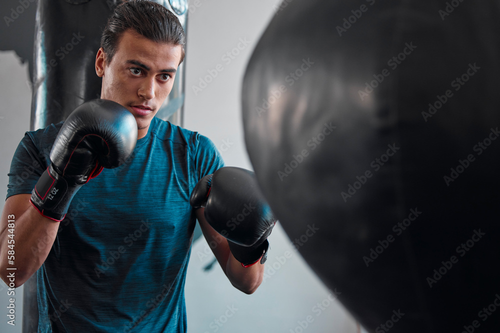 Sports, boxing and man with punching bag in gym for training, exercise ...