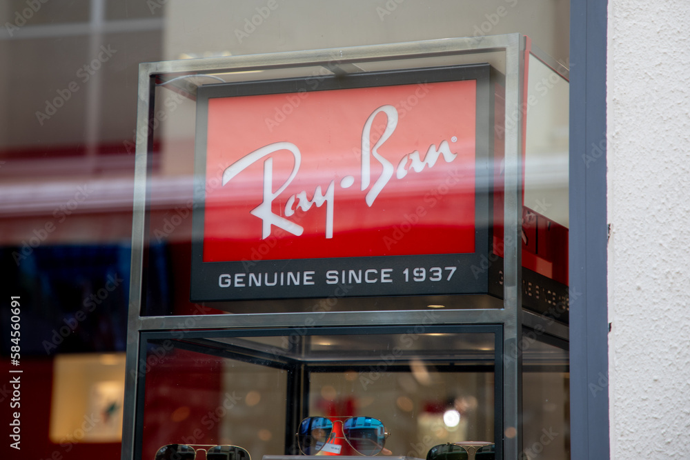 Ray ban sign brand and text logo on facade store of sunglasses ...