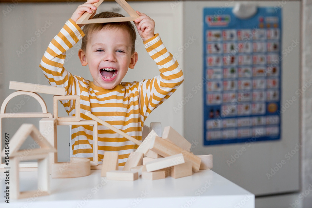 A little boy of 3 years old is playing a developing logistics ...