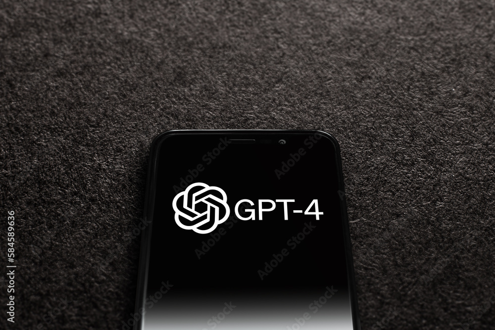 GPT-4 logo on screen smartphone on black textured background. GPT-4 is ...