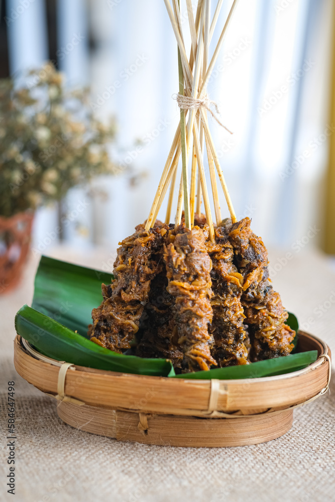 sate kerang or shell fish satay is a traditional Indonesian food made ...