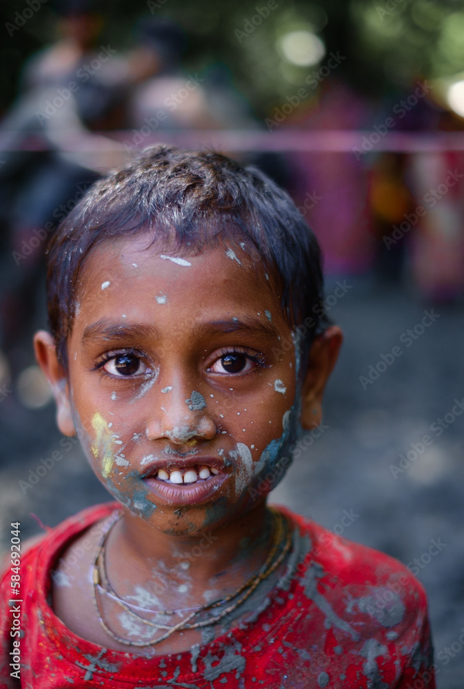South asian hindu religious little boy enjoying holi festival,the ...