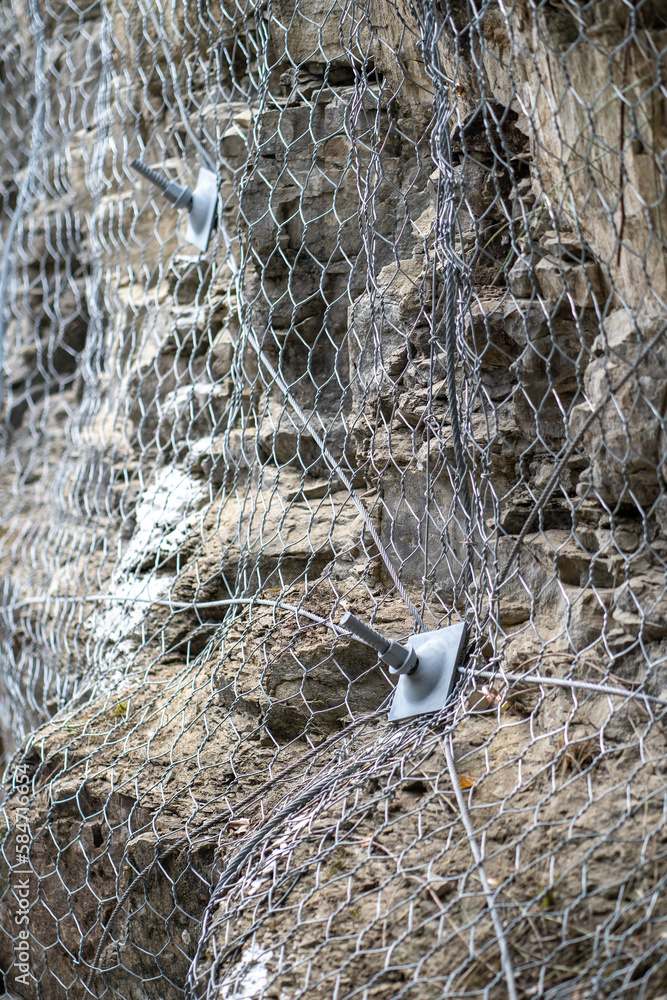 Reinforcing mountain slope with metal mesh and concrete reinforcement ...