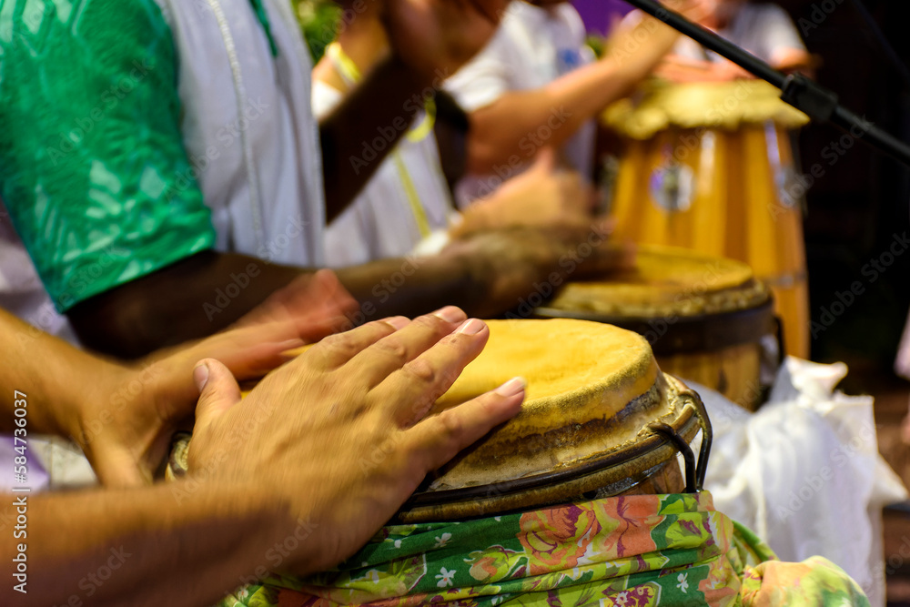 Drums called atabaque in Brazil being played during a ceremony typical ...