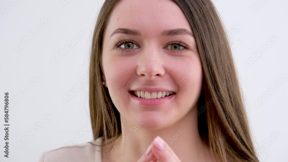 young girl clapped hands with admiration looks joy smile Delight gentle ...