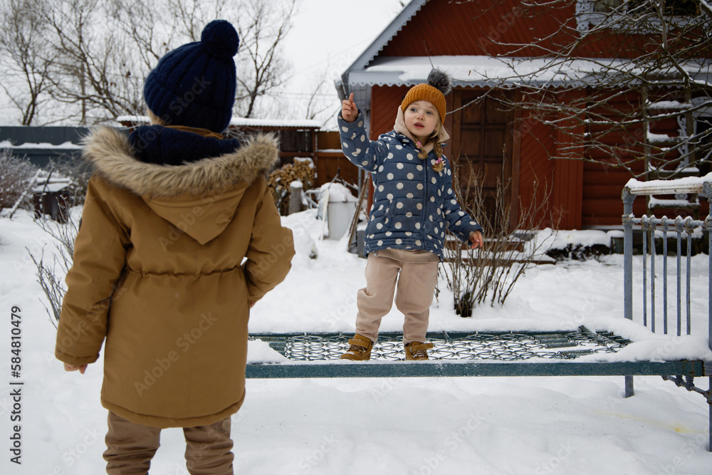Two little kids playing outside Stock Photo | Adobe Stock