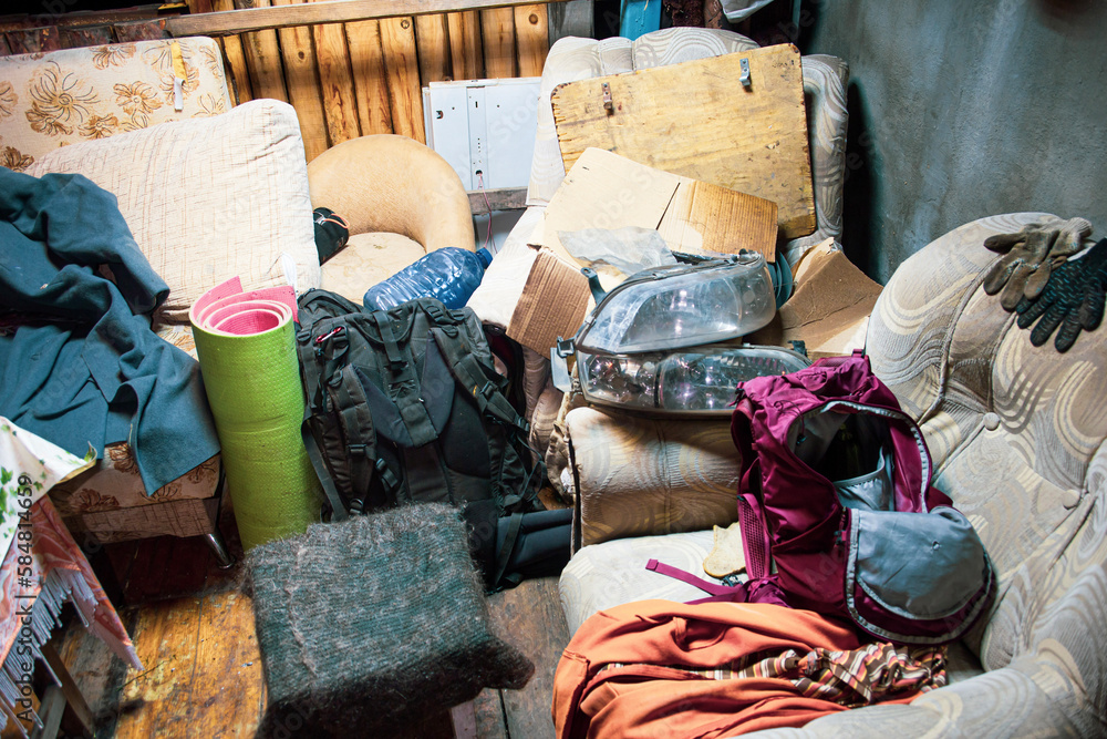 junk in the garage lying in a chaotic and chaotic position, the front ...
