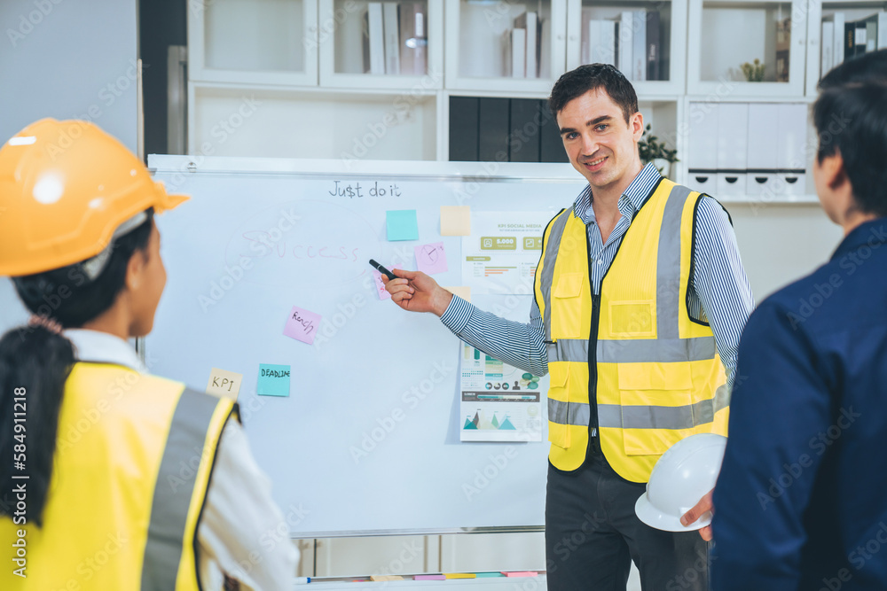 Entrepreneur brainstorming ideas with his competent engineers in the ...
