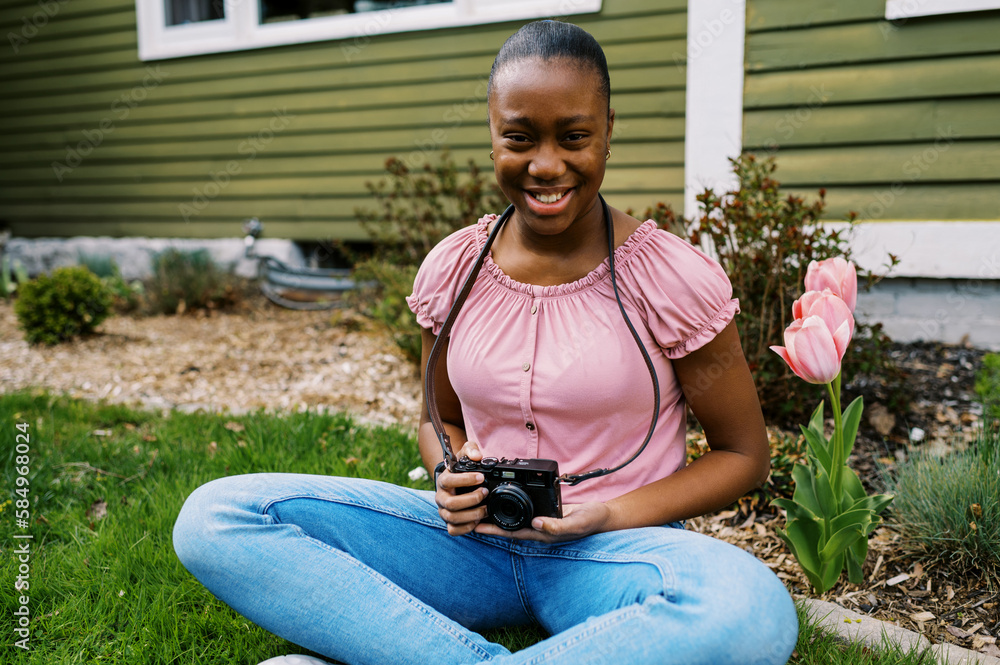 Smiling black tween girl using a point and shoot camera Stock Photo ...