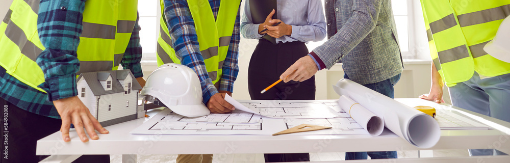 Construction team at a meeting. Group of young architects and builders ...