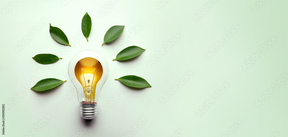 Green Energy Concepts. Wireless Light Bulb surrounded by Green Leaf as ...