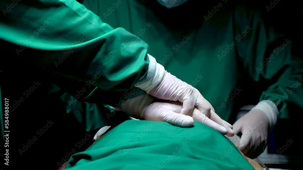 4K, Doctor hands are intertwined on chest patient undergoing surgery ...