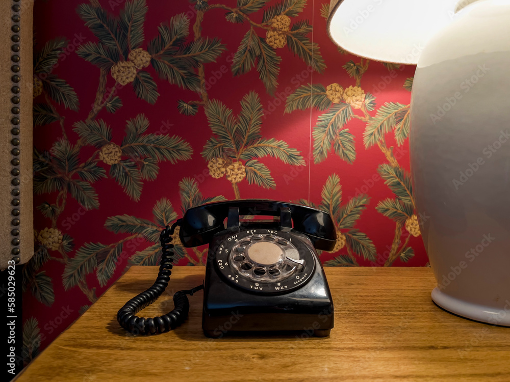 Vintage black Rotary Dial Telephone and funky wallpaper Stock Photo ...