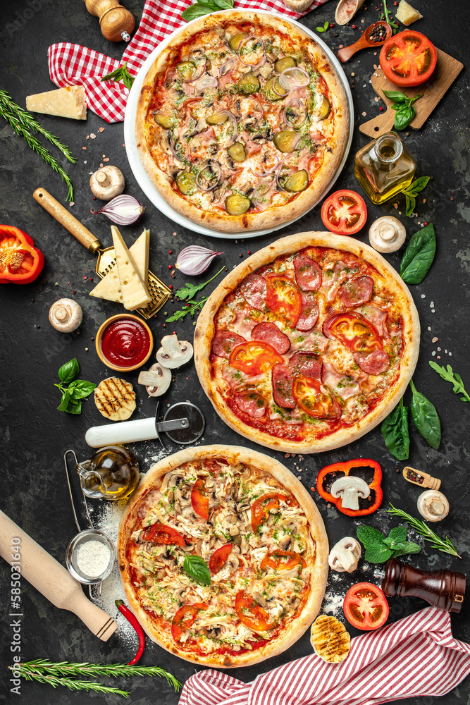Set Pizza background. various kinds of Italian pizza on a dark ...
