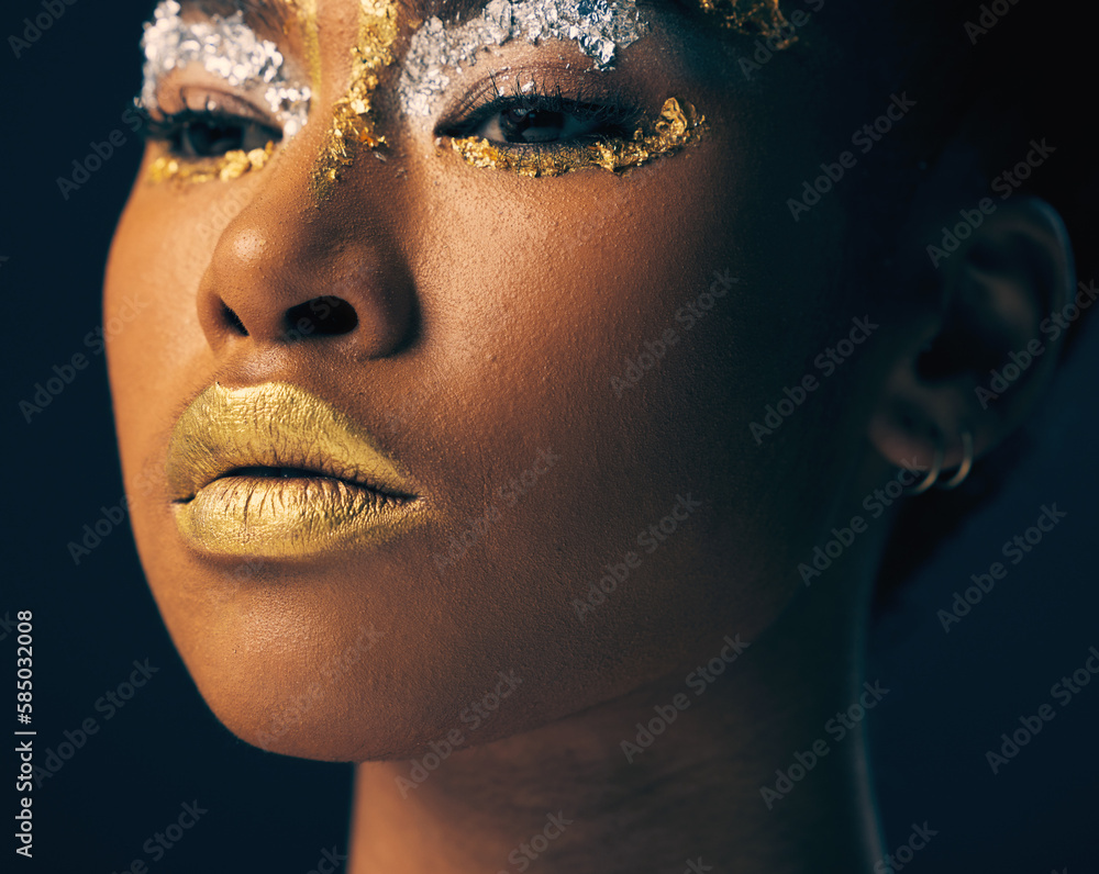 Beauty, gold and face with black woman and makeup in studio for luxury ...