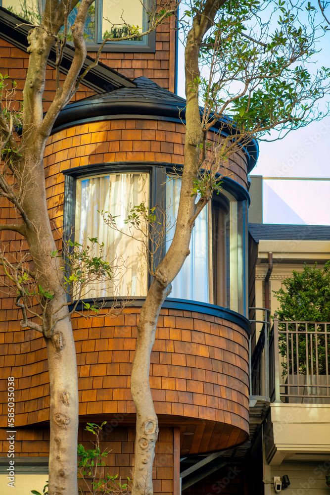 Building turret or spire with panoramic glass bay window on exterior of ...