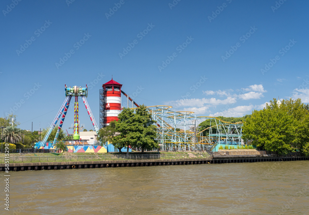 Slide, swing and roller coaster in the Parque de la Costa funfair and ...
