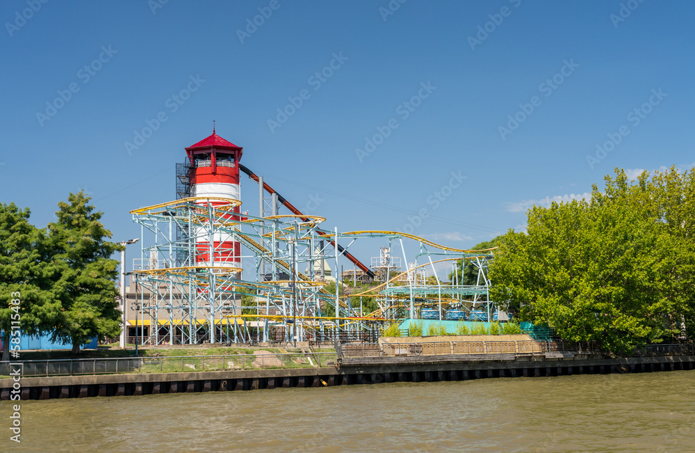 Slide, swing and roller coaster in the Parque de la Costa funfair and ...