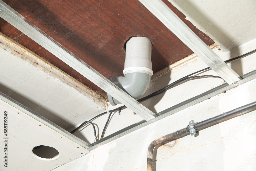 Installation of chimney pipe at kitchen. Stock Photo | Adobe Stock