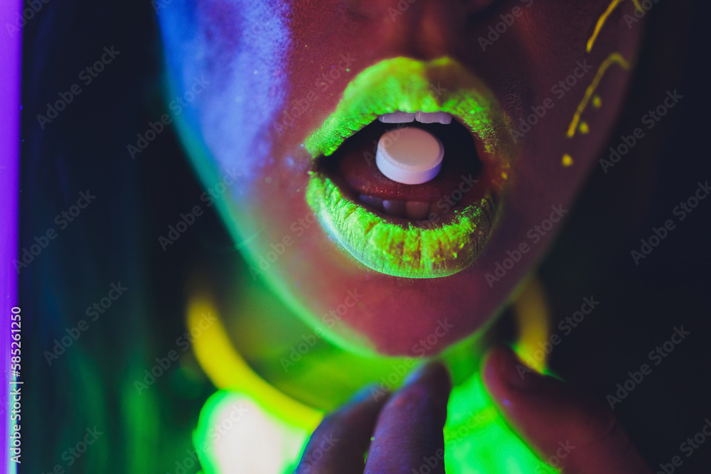 beautiful girl with lsd on tongue in nightclub with pink smoke. Stock ...