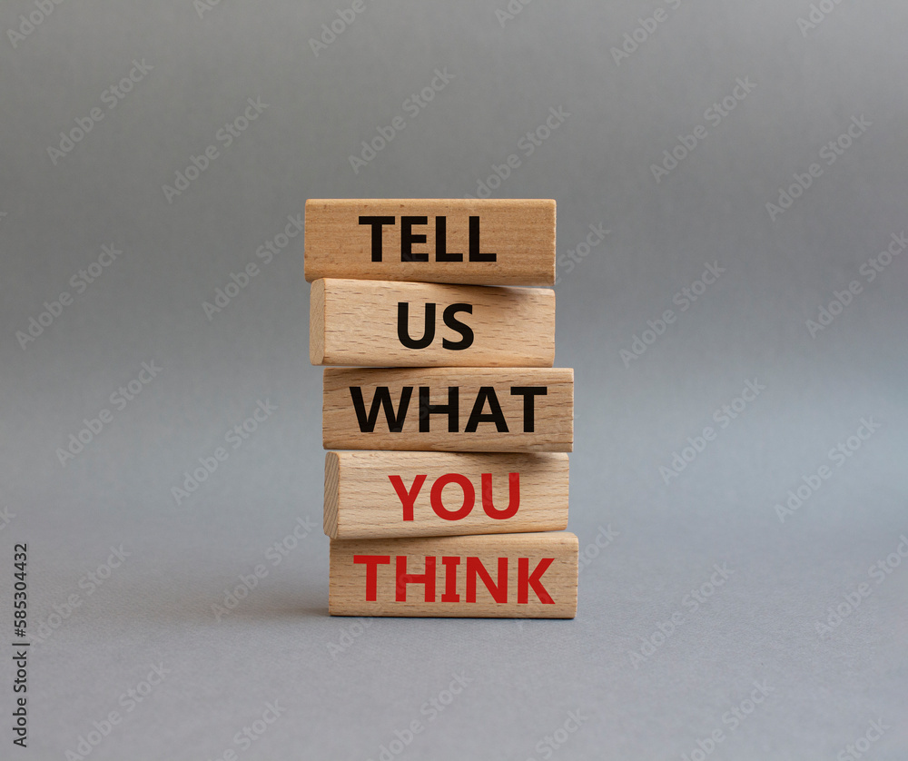 Tell us what you think symbol. Wooden blocks with words Tell us what ...