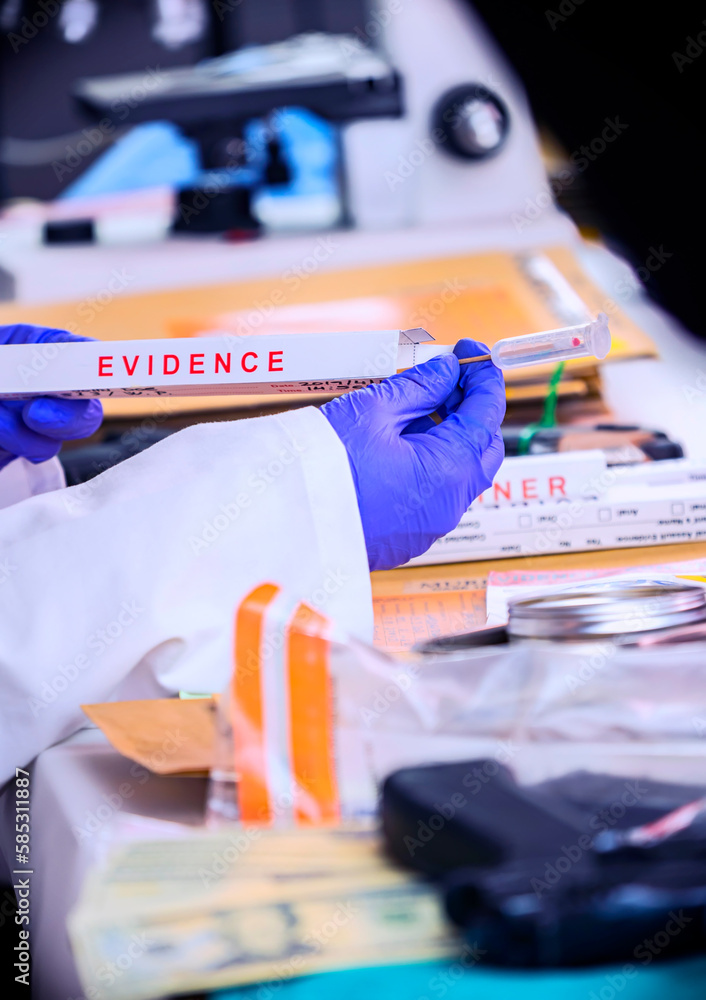 Police scientist pulls out isope with sample of evidence implicated in ...