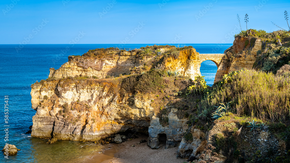 Ponte Romana de Lagos, an ancient Roman bridge, spans between two ...